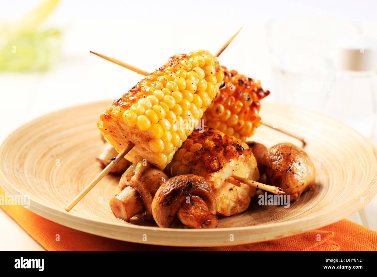 Grilled sweet corn cobs and button mushrooms Stock Photo - Alamy