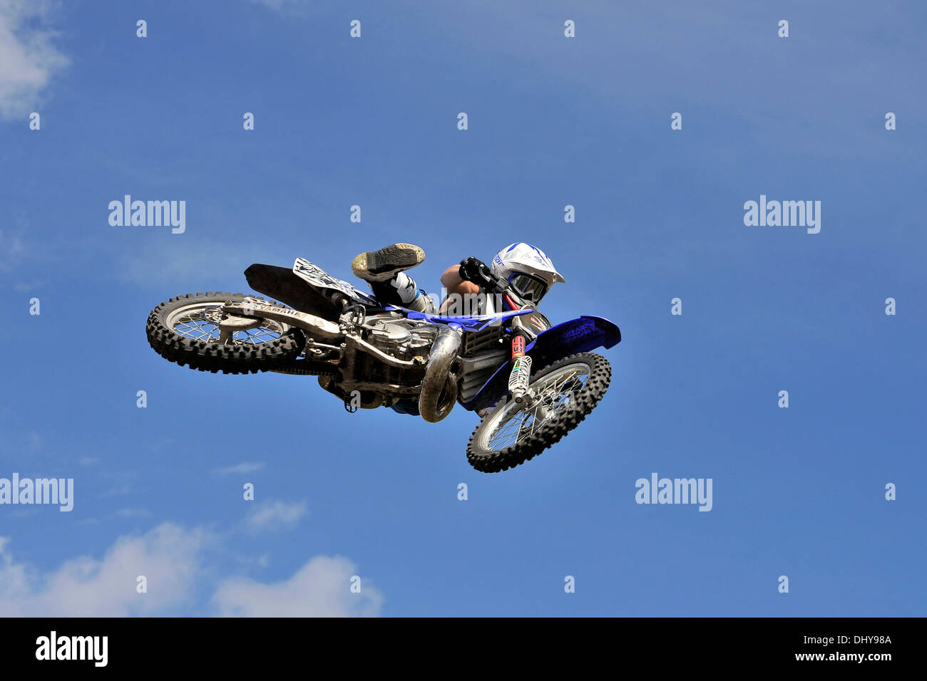 A high flying motocross rider preforming an aerial stunt Stock Photo ...