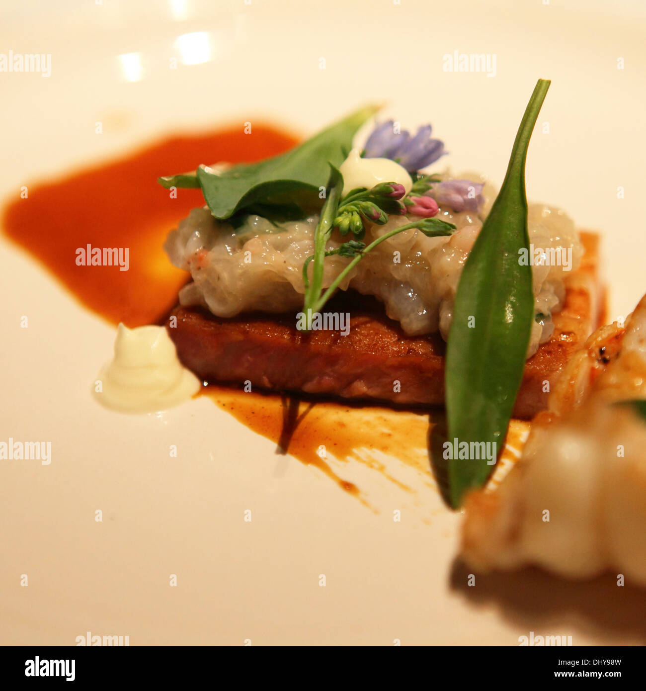 An attractively presented appetizer topped with fish roe and edible ...