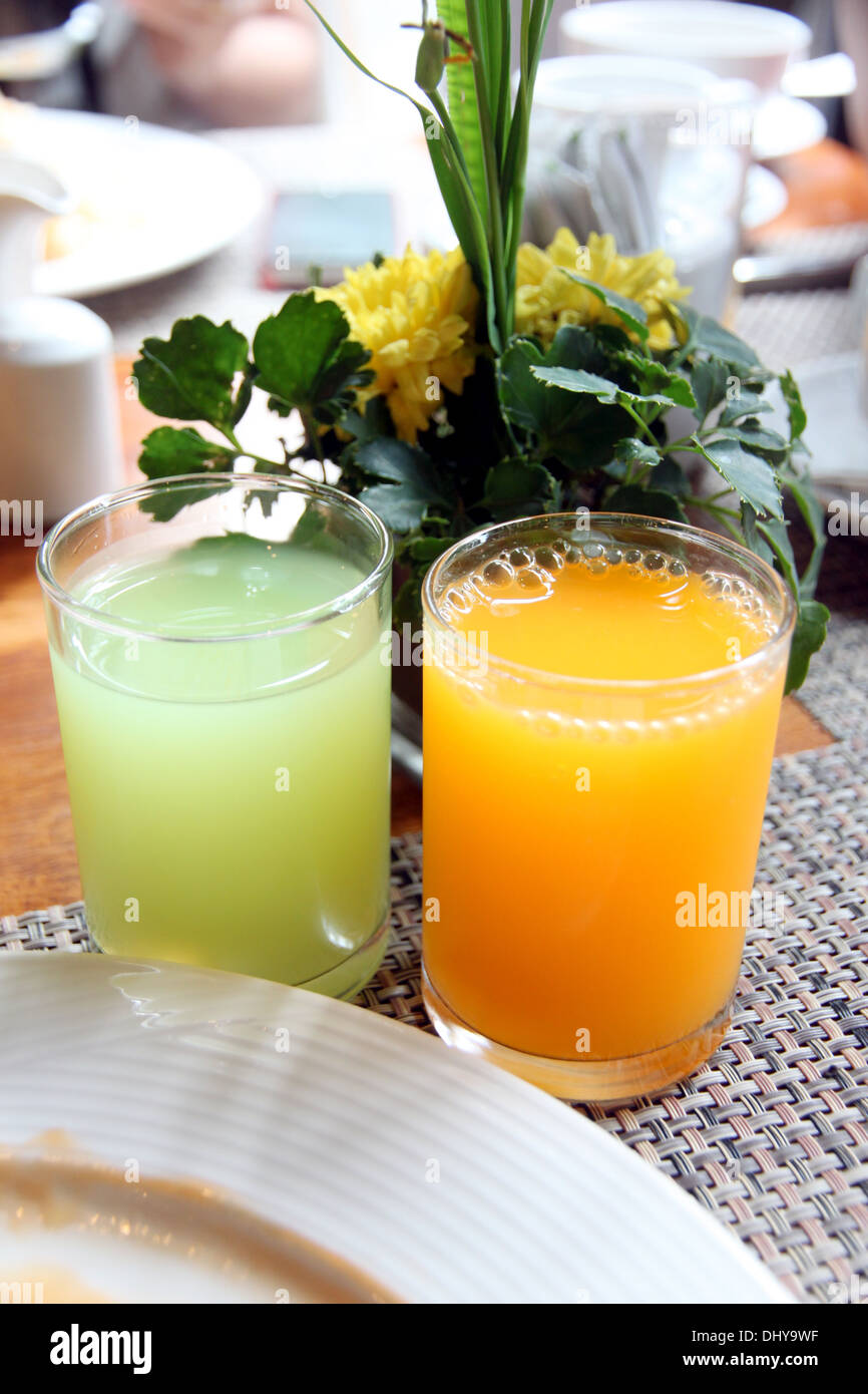 The Fruit Juice in glass Near the white dish Stock Photo - Alamy