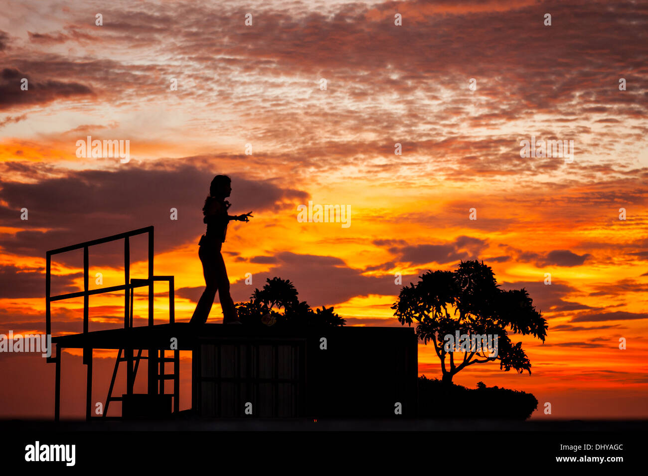 Silhouette Trainer Aerobics exercise on stage with sunrise Stock Photo ...