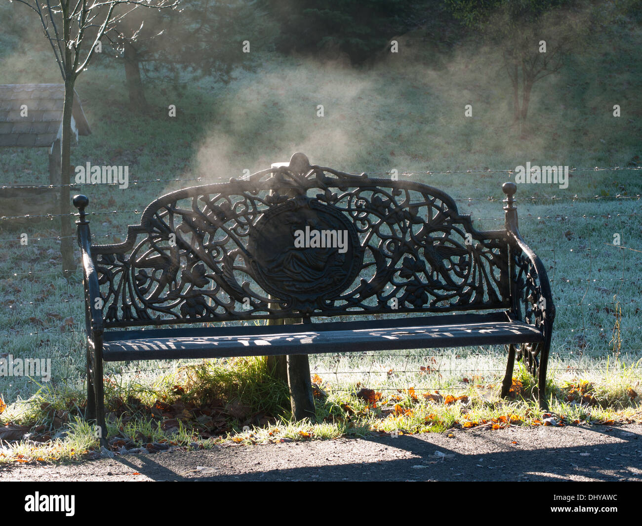 Mist rising from wrought-iron bench Stock Photo - Alamy