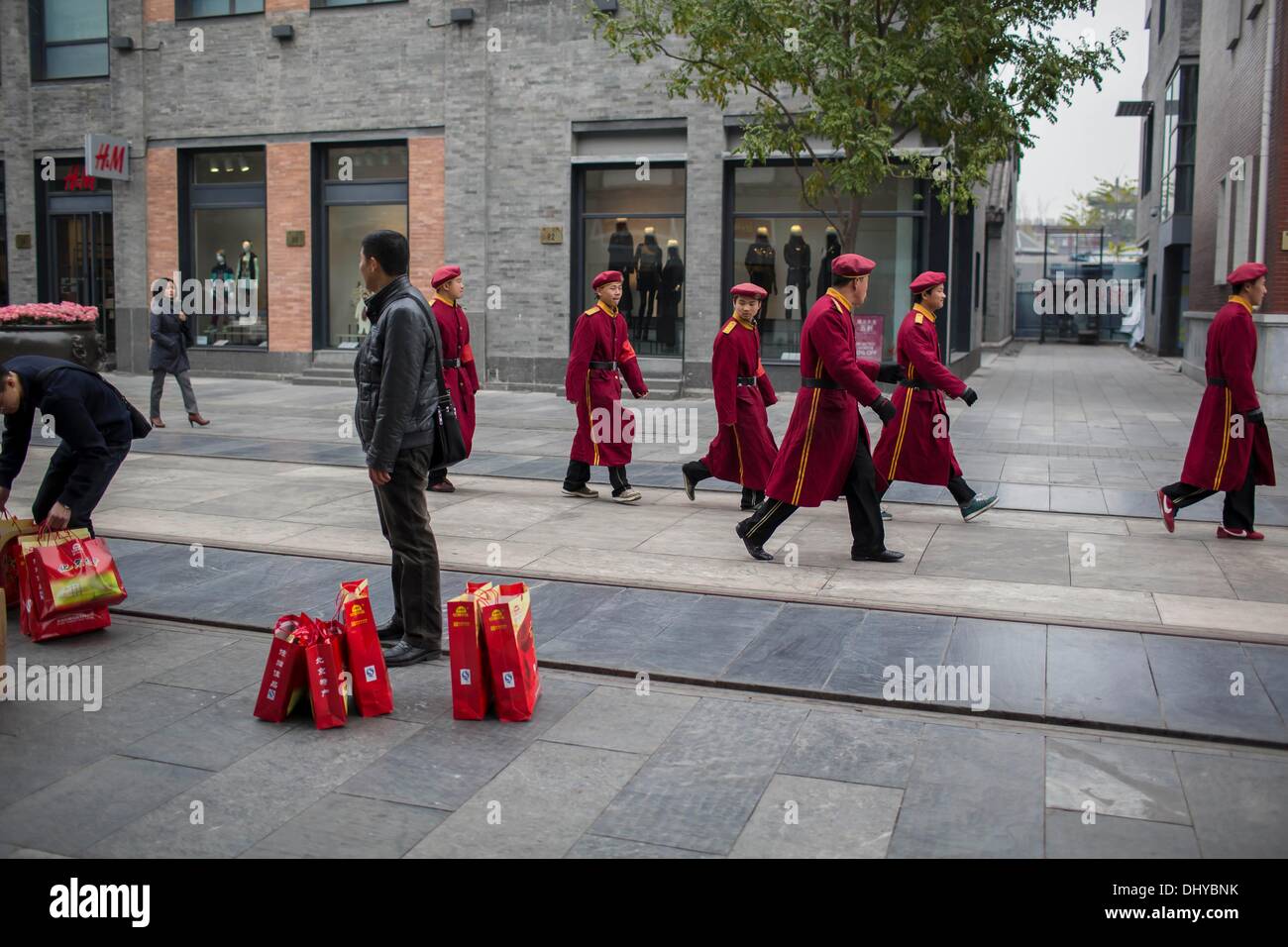 Beijing, China. 9th Nov, 2013. A group of Security Guards walk through ...