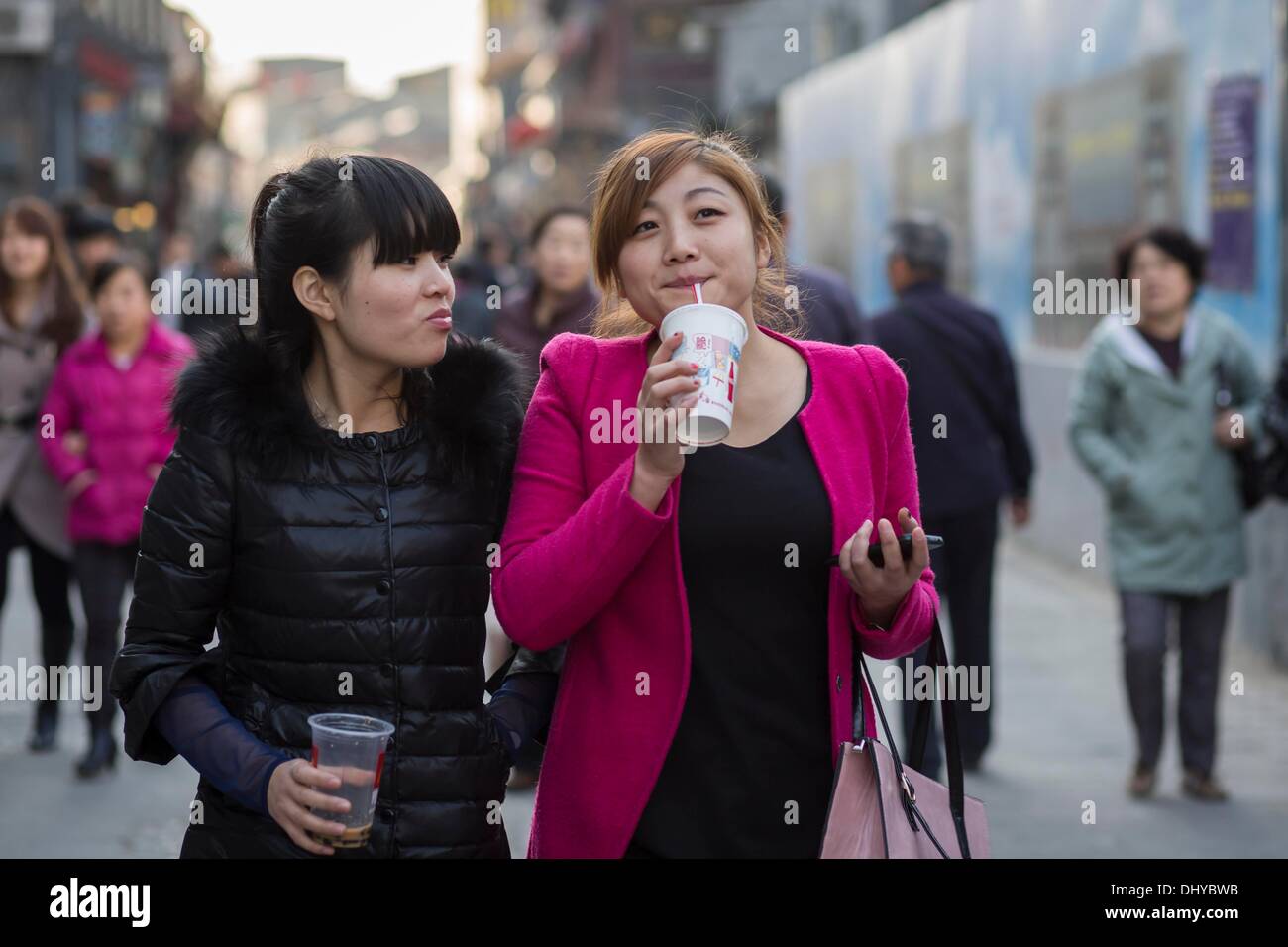 Beijing, China. 11th Nov, 2013. Two girls were walking on the Qianmen ...