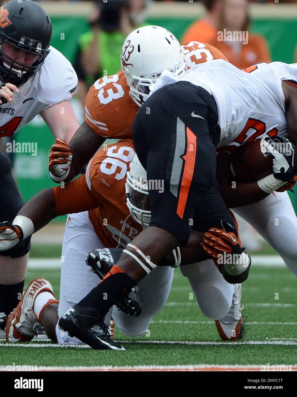 Nov 16, 2013. Chris Whaley #96 and Steve Edmond #33 of the Texas ...