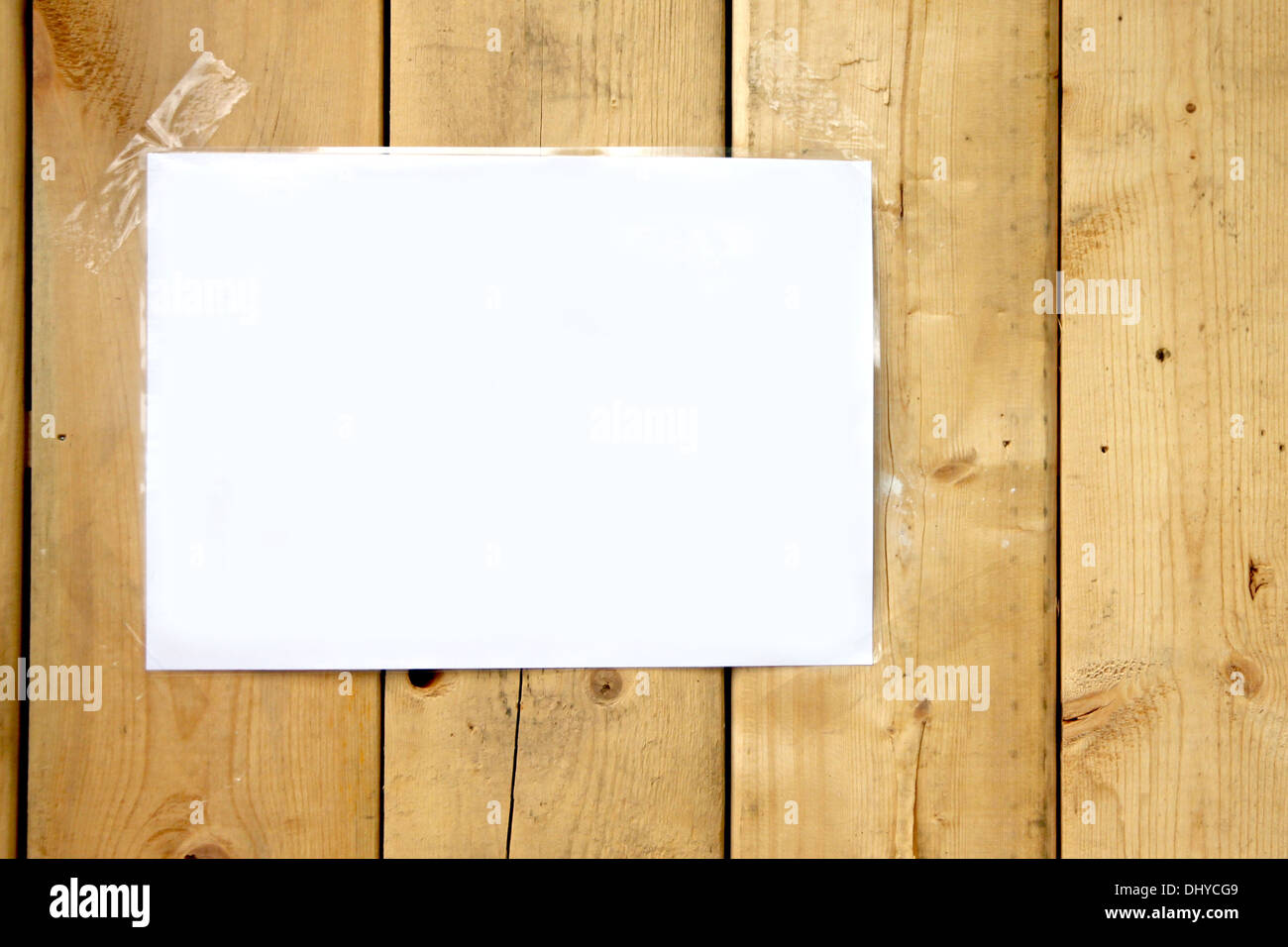 The White label stuck on the wooden of background Stock Photo - Alamy