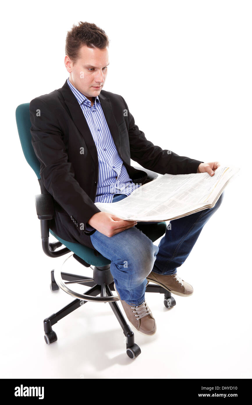 Full length businessman sitting on chair reading a newspaper isolated ...