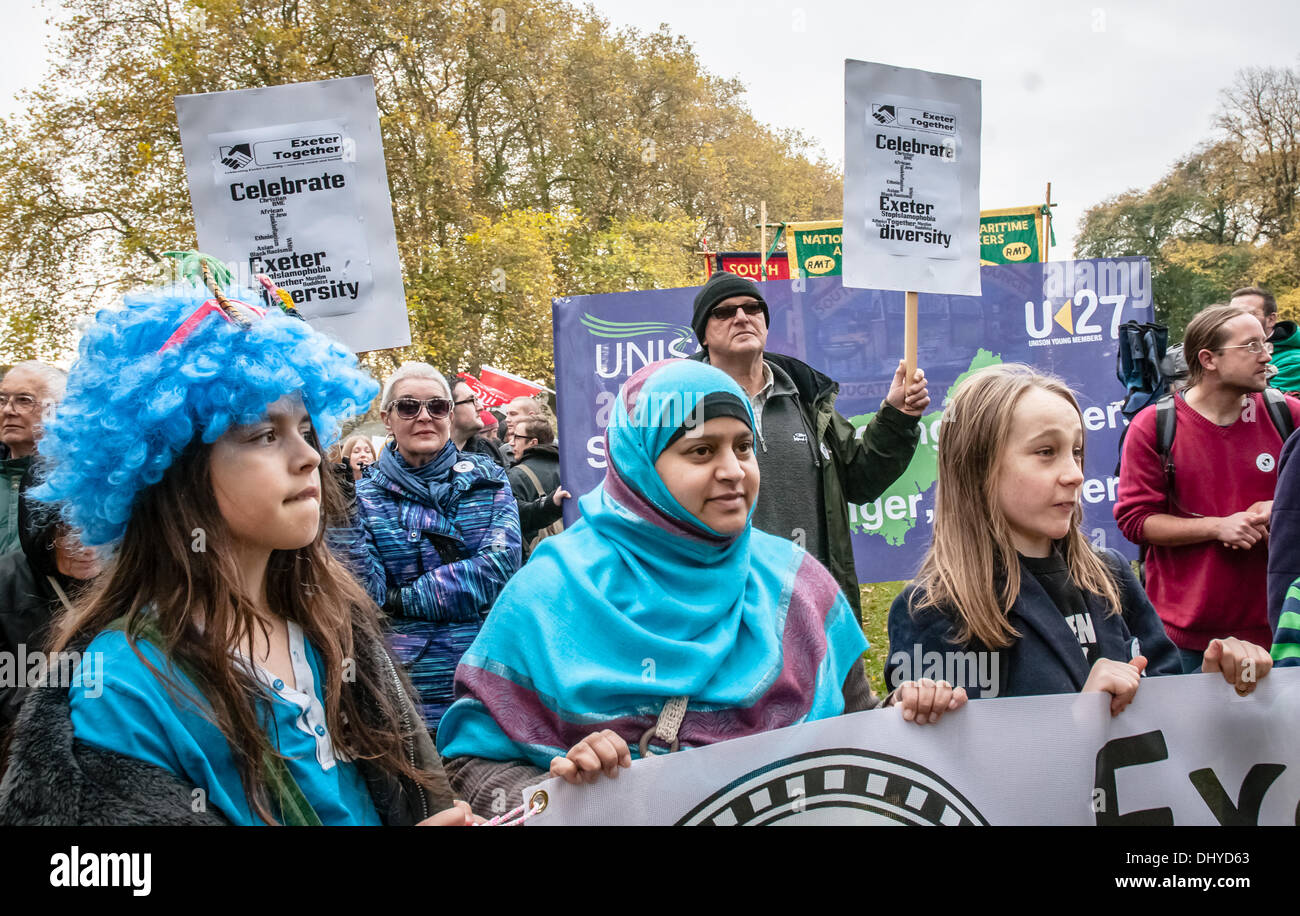 Adults and children hold the banner during the Exeter Together march ...