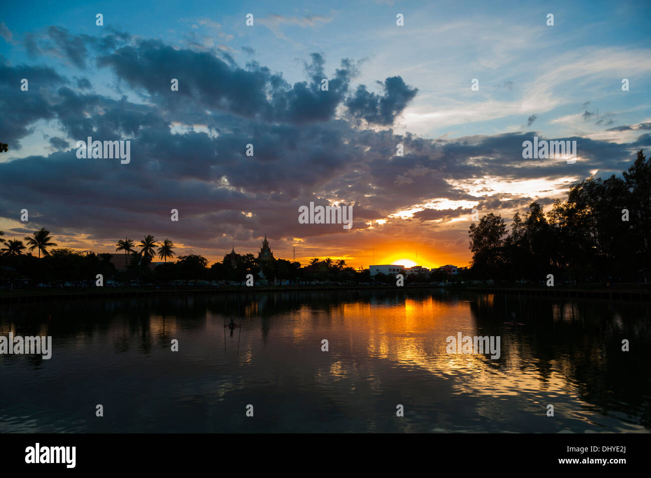 Temple in sunset sky with tree reflection Stock Photo - Alamy