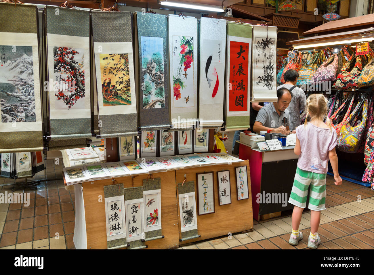 A stall inside Central Market selling Chinese calligraphy artworks ...