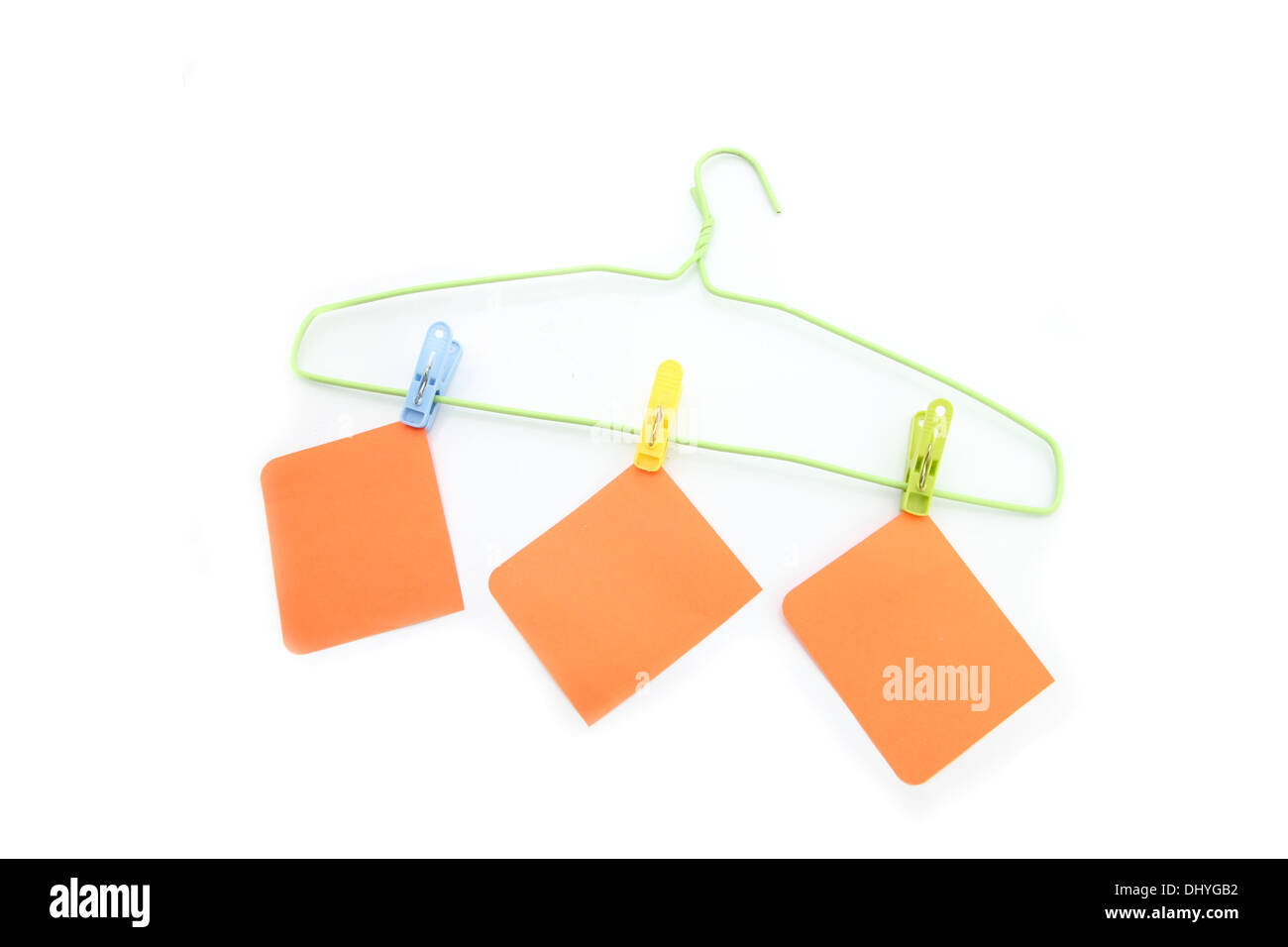 The Note paper and hanger on the white background Stock Photo - Alamy