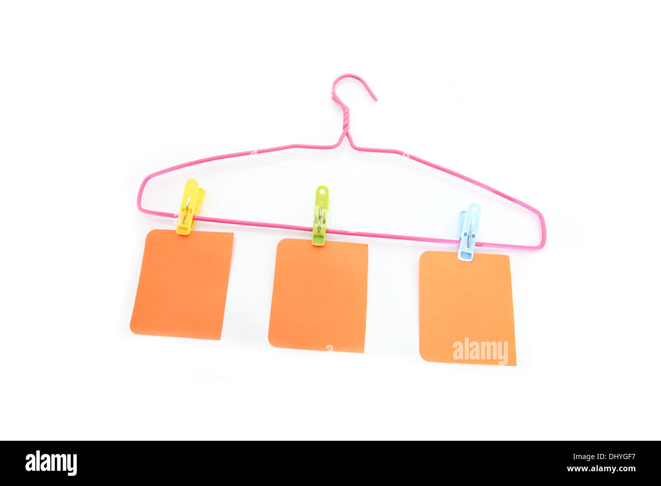 The Note paper and hanger on the white background Stock Photo - Alamy