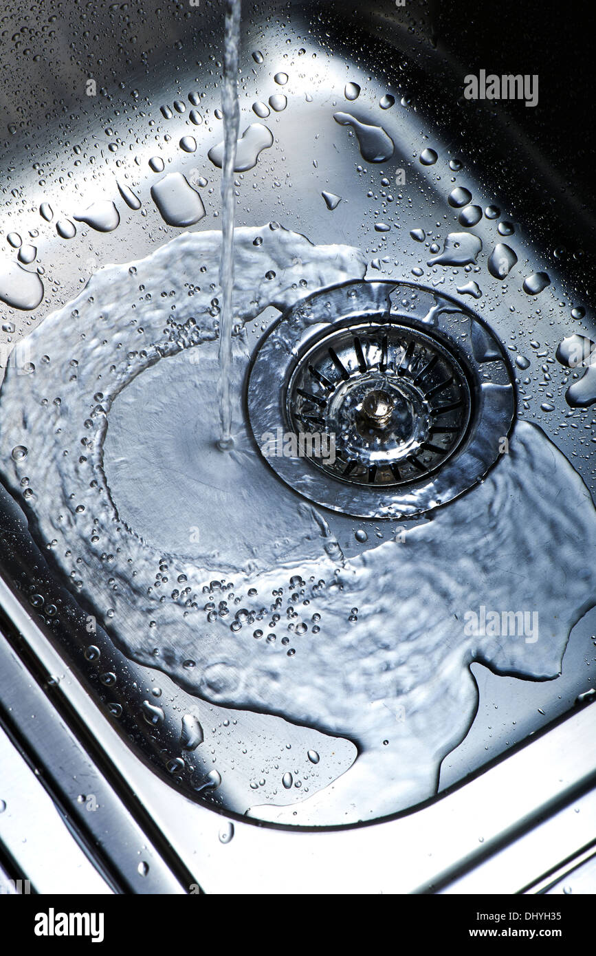 Water and droplets in sink Stock Photo - Alamy