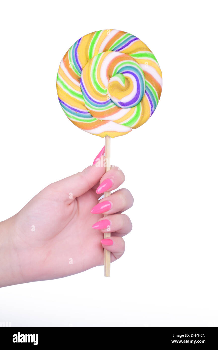 Hand holding giant colorful lollipop isolated on white Stock Photo - Alamy