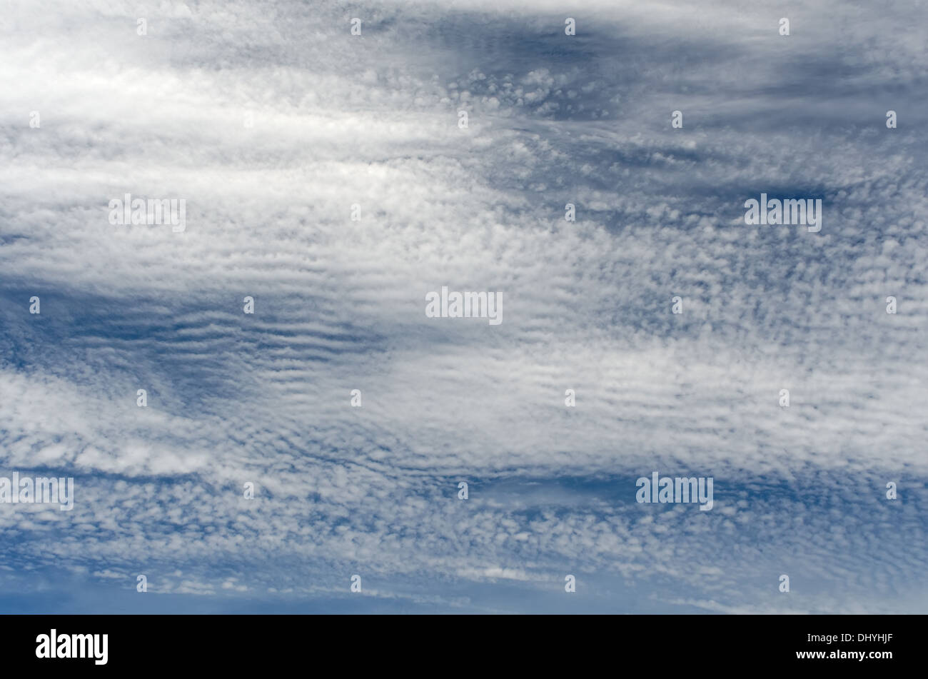 Cirrocumulus clouds and cirrus radiatus Stock Photo - Alamy