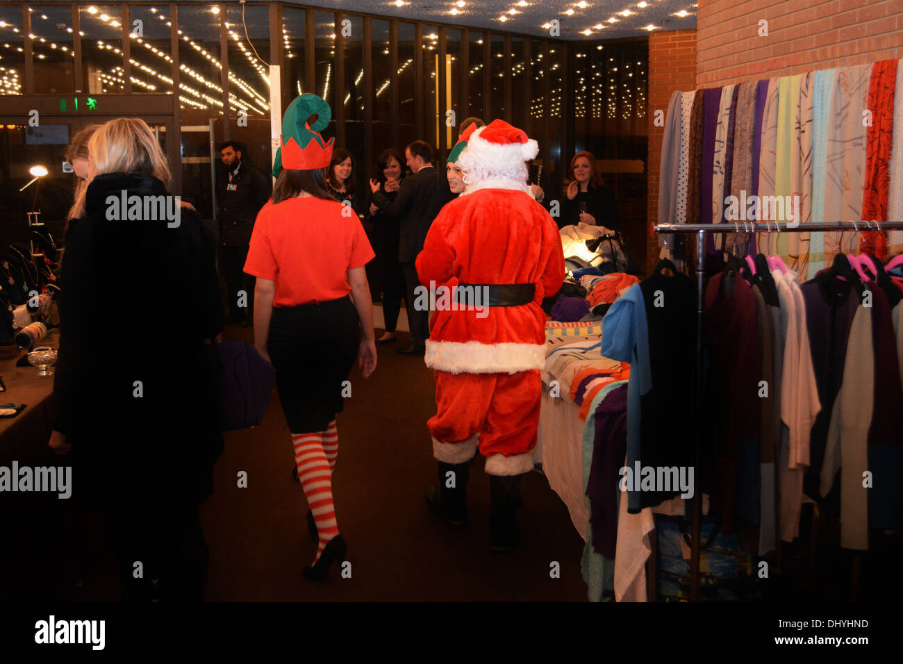 Santa and his elf doing some shopping for Christmas! Stock Photo - Alamy