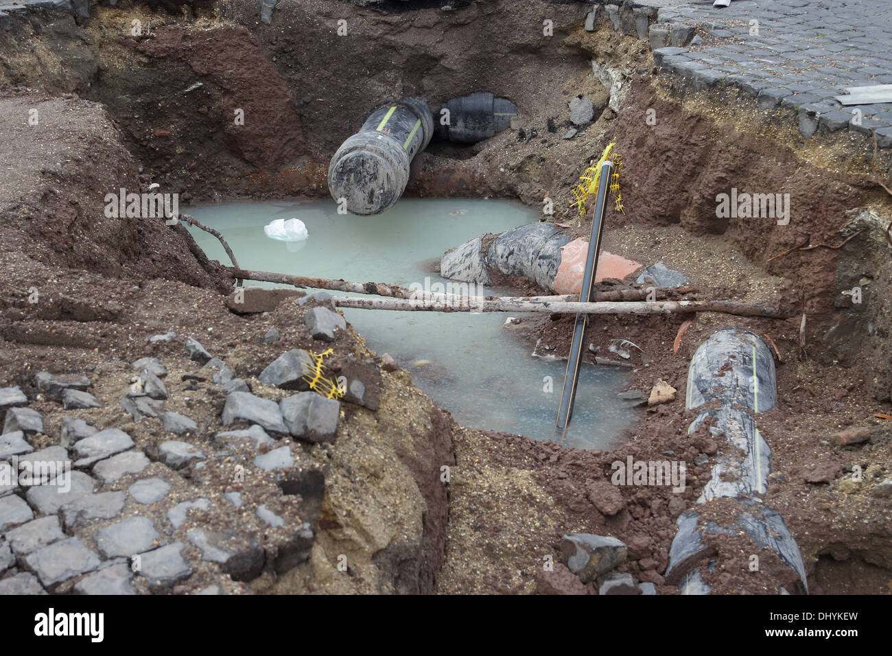 road working progress, pipes under road surface Stock Photo - Alamy
