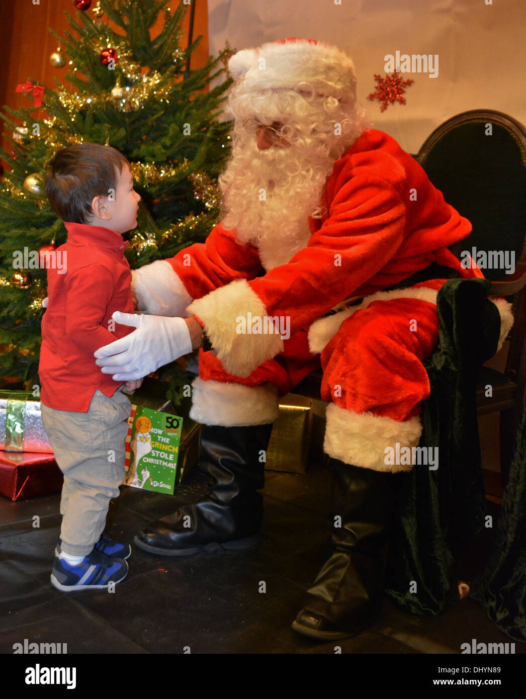 Small boy meets Santa Stock Photo - Alamy