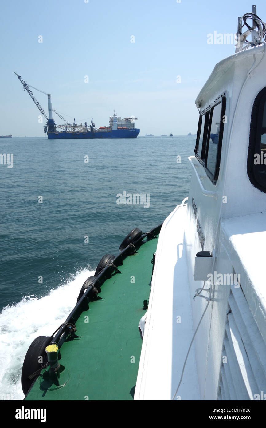 Approaching working ship Stock Photo - Alamy