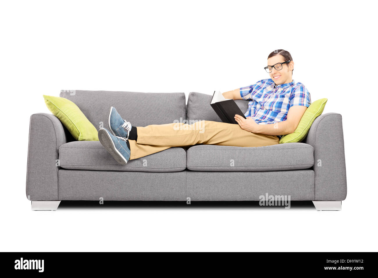Reading on sofa Cut Out Stock Images & Pictures - Alamy