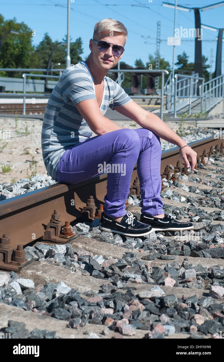 One man on train tracks Stock Photo - Alamy