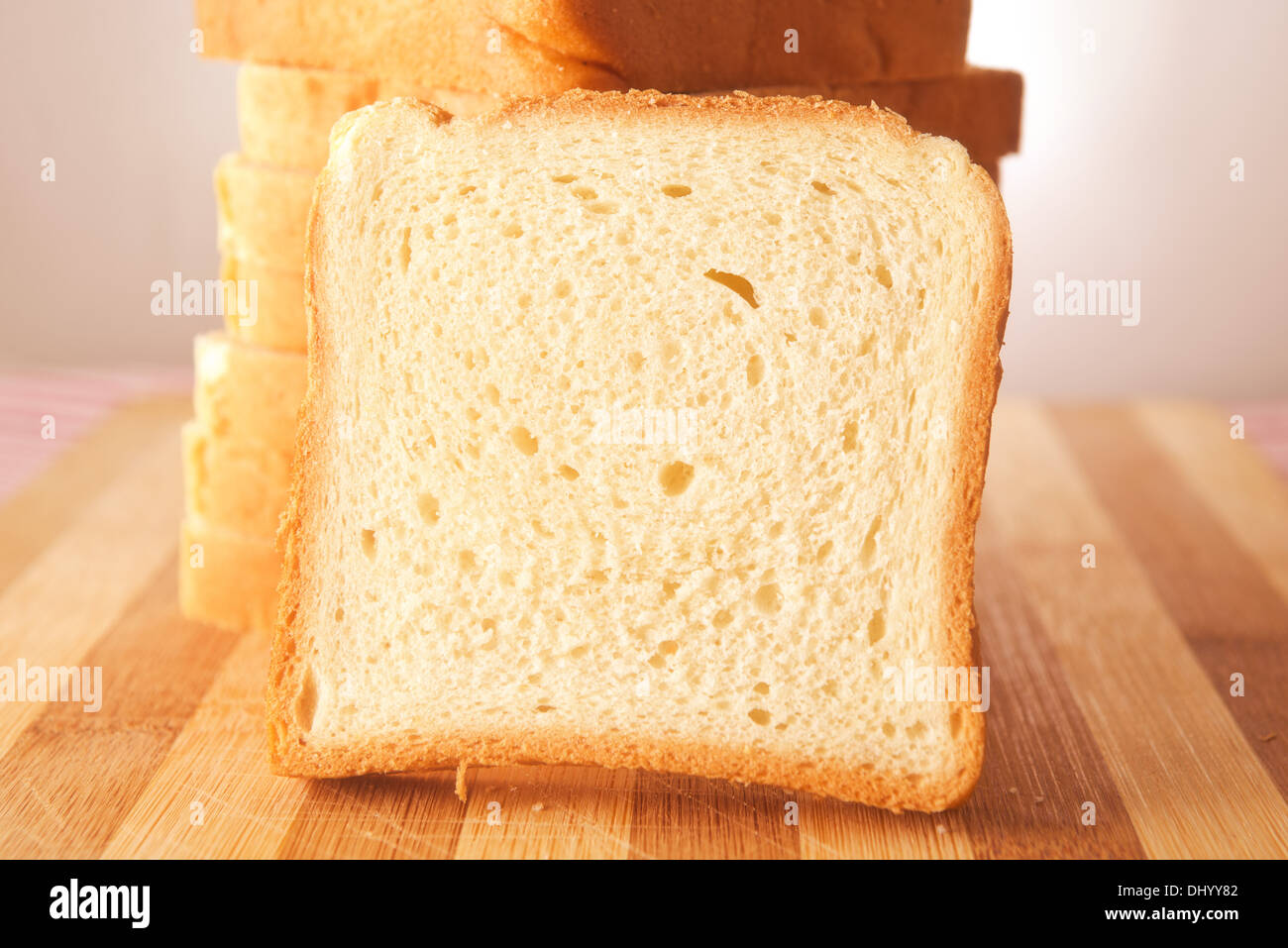 White Toast Bread on wooden kitchen table Stock Photo - Alamy