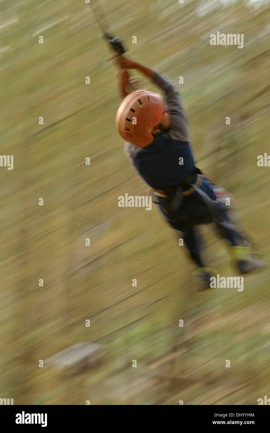 Kids swinging from a rope in an adventure camp in India Stock Photo - Alamy