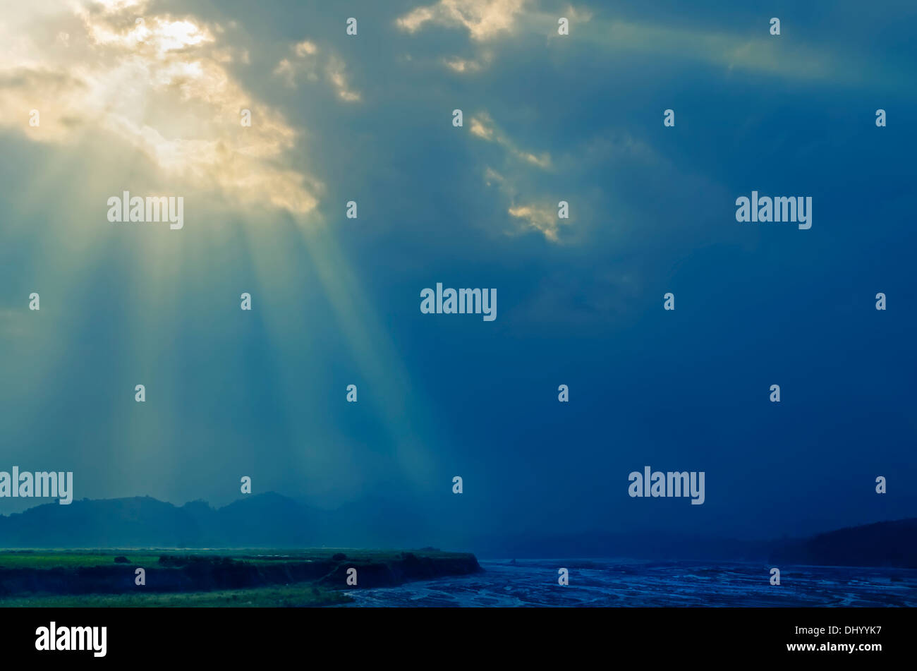 God light shining on lahar-covered river Stock Photo - Alamy