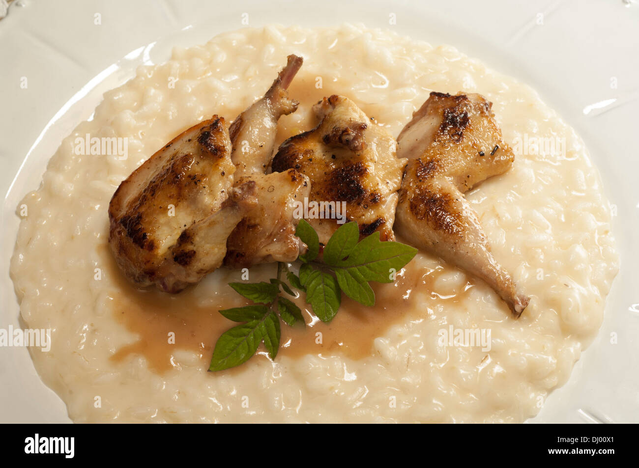 Parmesan Risotto with quails Stock Photo - Alamy