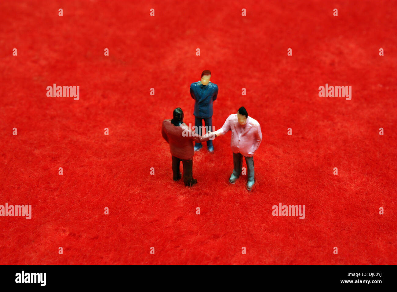 Business meetings and negotiations on a red background Stock Photo - Alamy