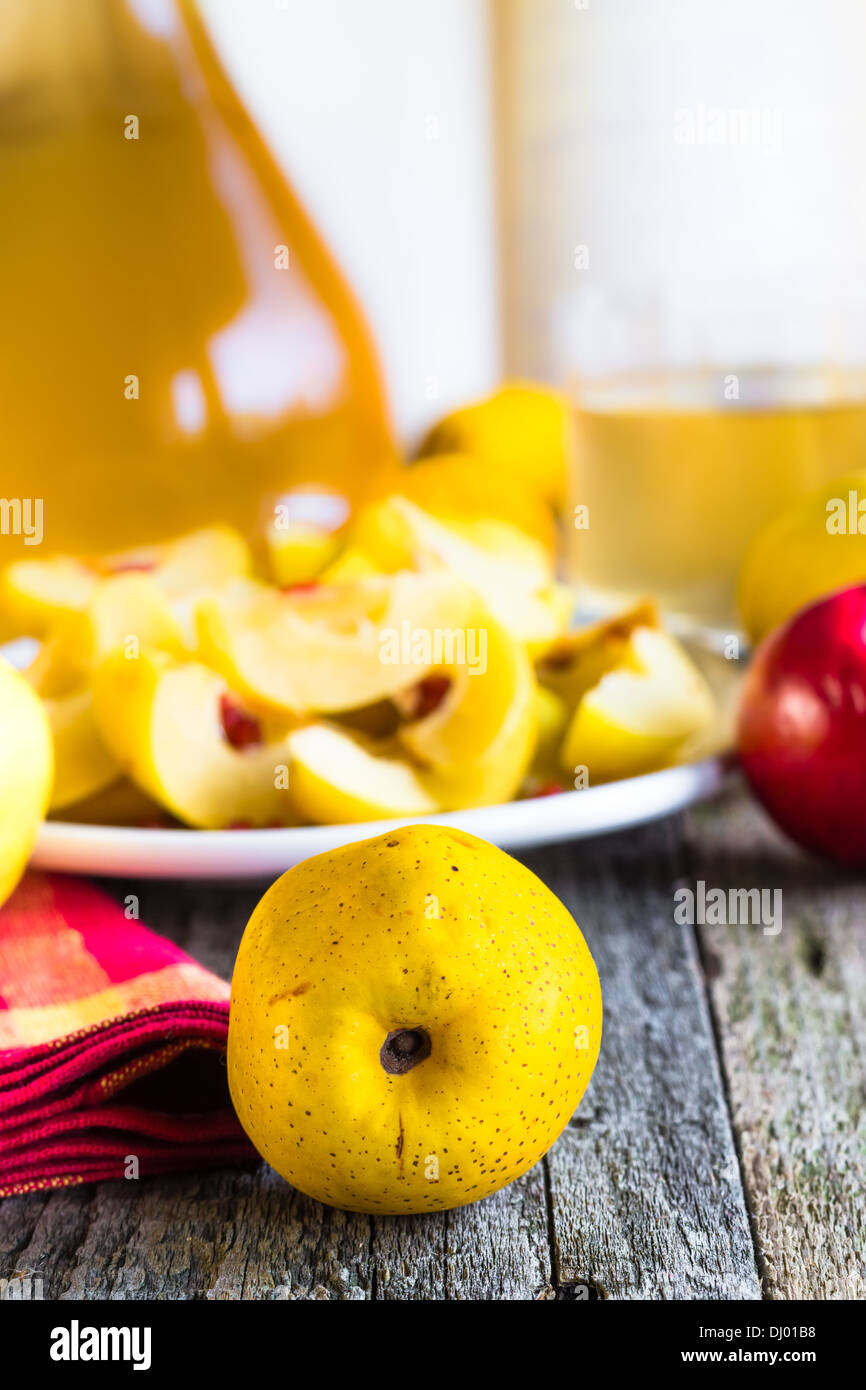 Cut fruit quince, apples and ready tincture Stock Photo - Alamy