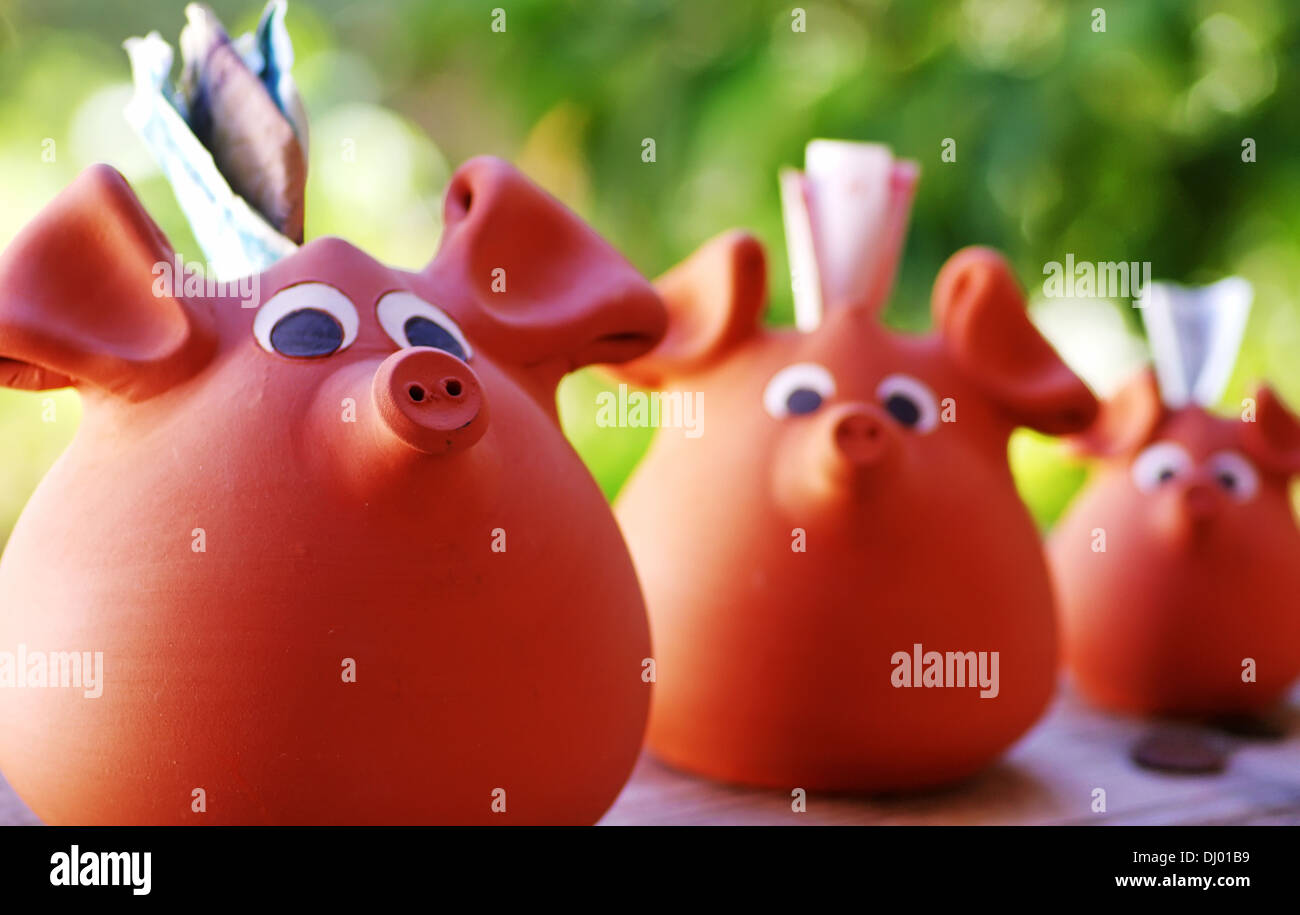 Three ceramic piggy banks Stock Photo - Alamy