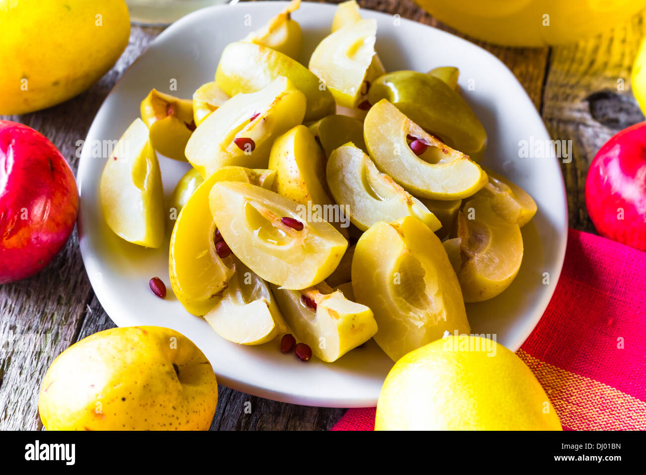 Cut fruit quince, apples and ready tincture Stock Photo - Alamy