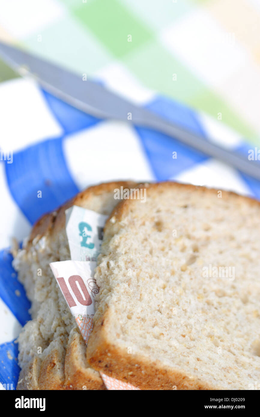 Bread sandwich with money cash on a plate concept Stock Photo - Alamy