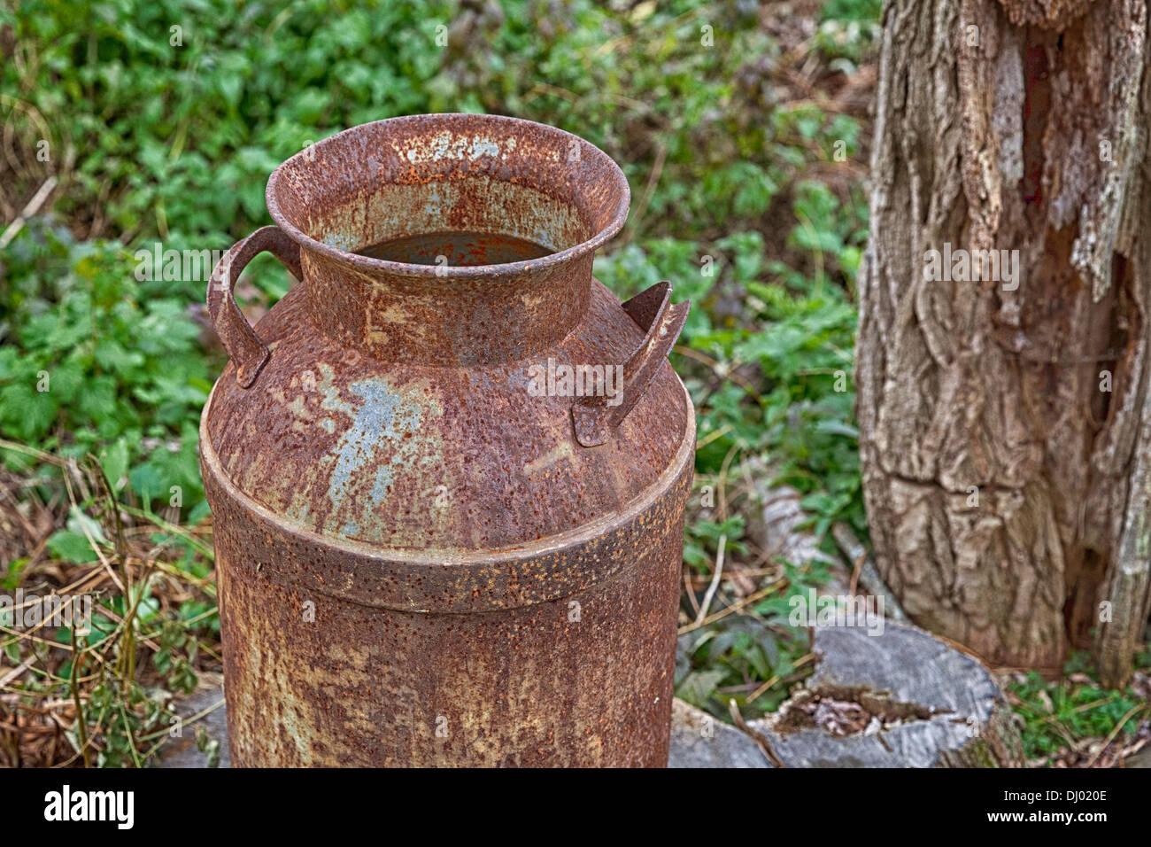 old rusted metal milk barrel Stock Photo - Alamy