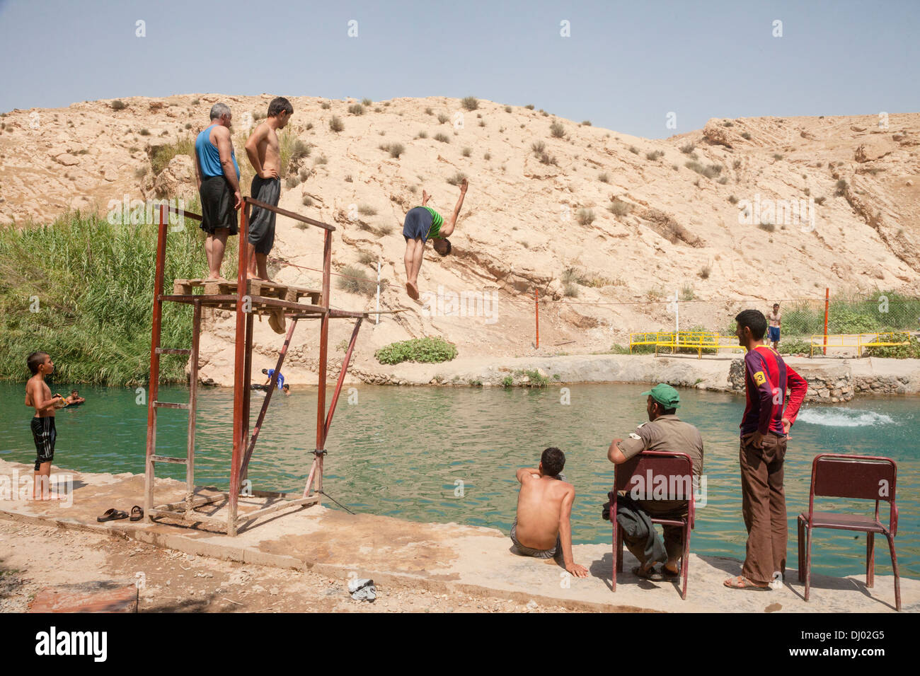 Boy diving in a pond in northern iraq Stock Photo - Alamy