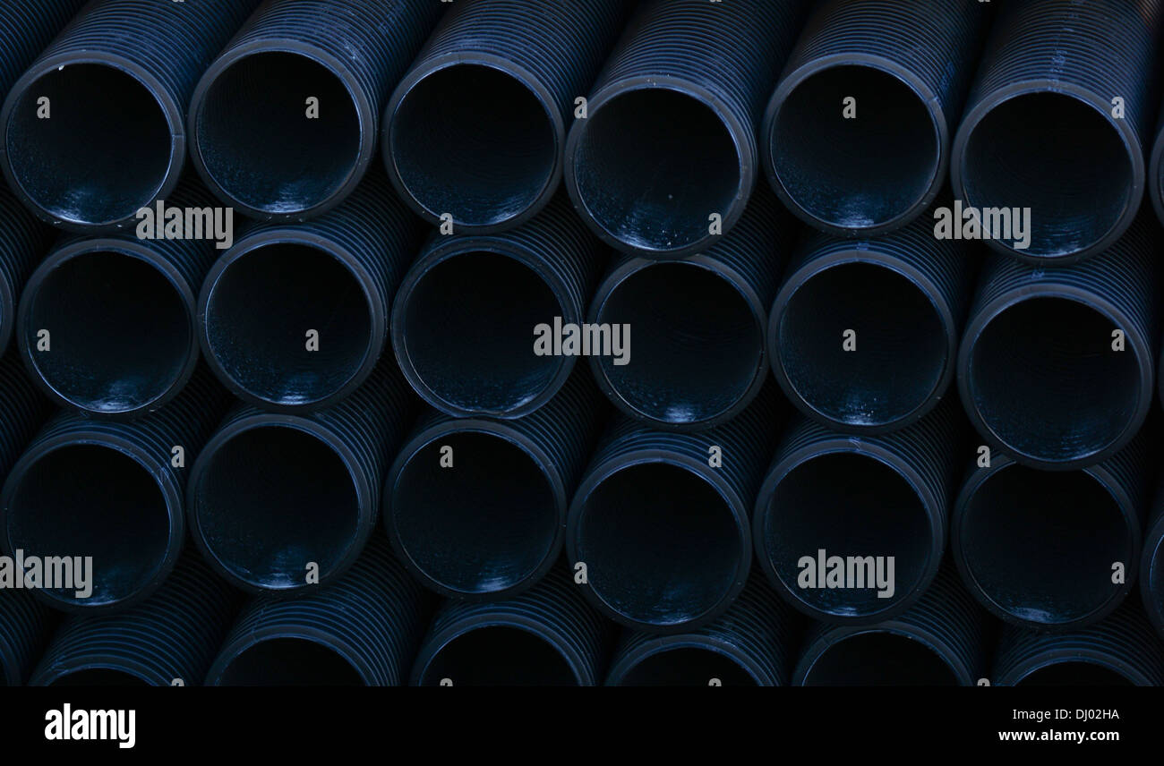 Plastic industrial pipes background Stock Photo - Alamy