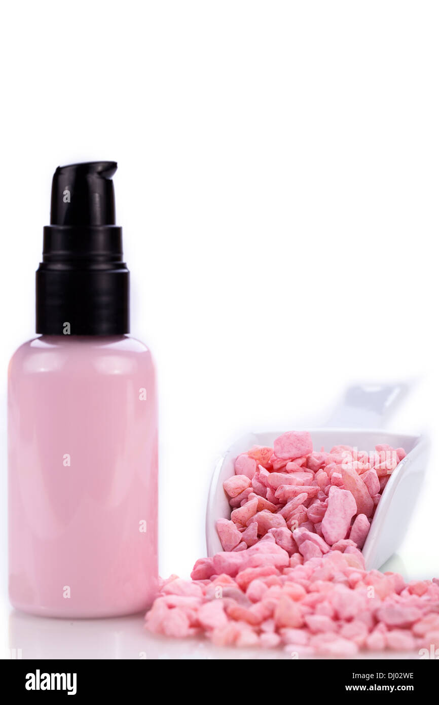 pink body lotion in dispenser and aroma salt isolated wellness spa ...
