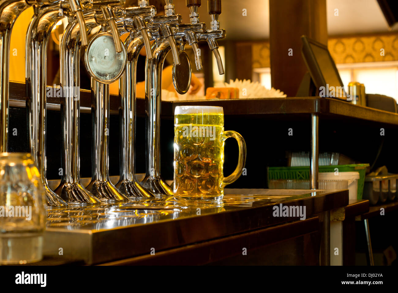 Row of taps attached to metal beer kegs in a bar Stock Photo - Alamy