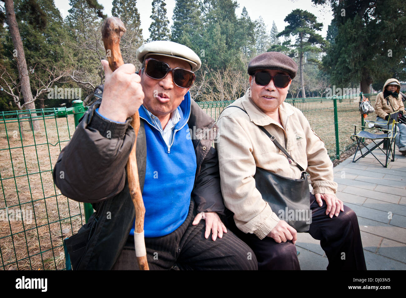Old chinese man walking stick hi-res stock photography and images - Alamy