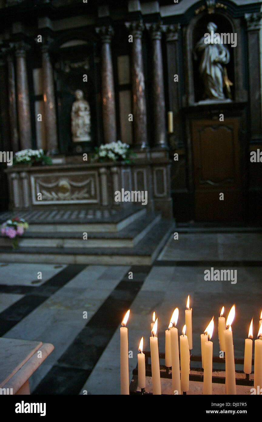 Candles inside Bruges' Onze Lieve Vrouwekerk (Church of Our Lady), Michelangelo's "Madonna and ...
