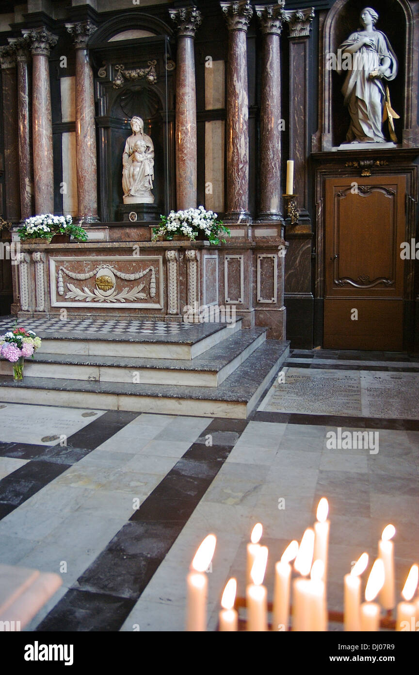 Candles inside Bruges' Onze Lieve Vrouwekerk (Church of Our Lady), Michelangelo's "Madonna and ...