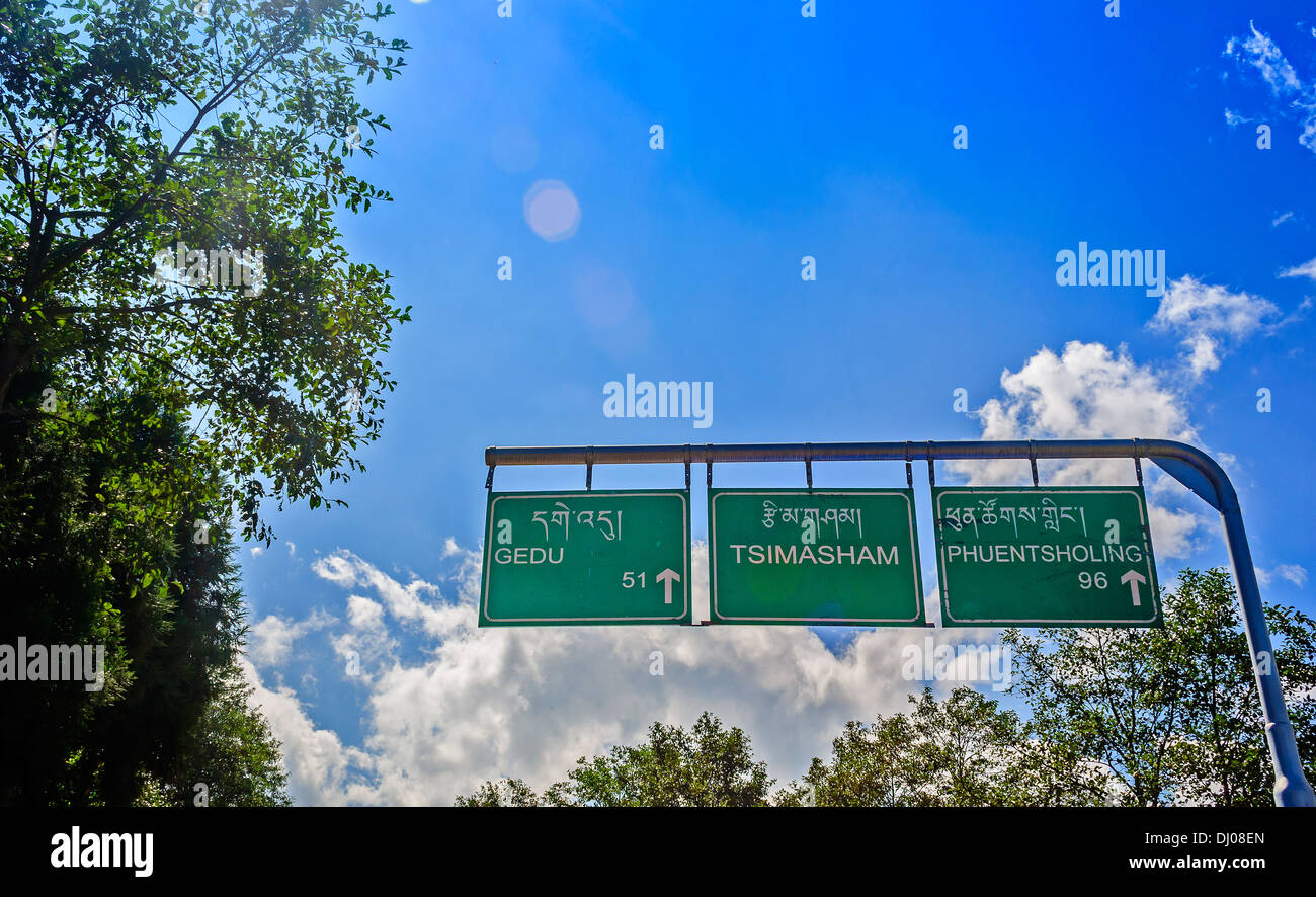 Road sign on the road to Thimphu, Bhutan against bright blue sky Stock ...