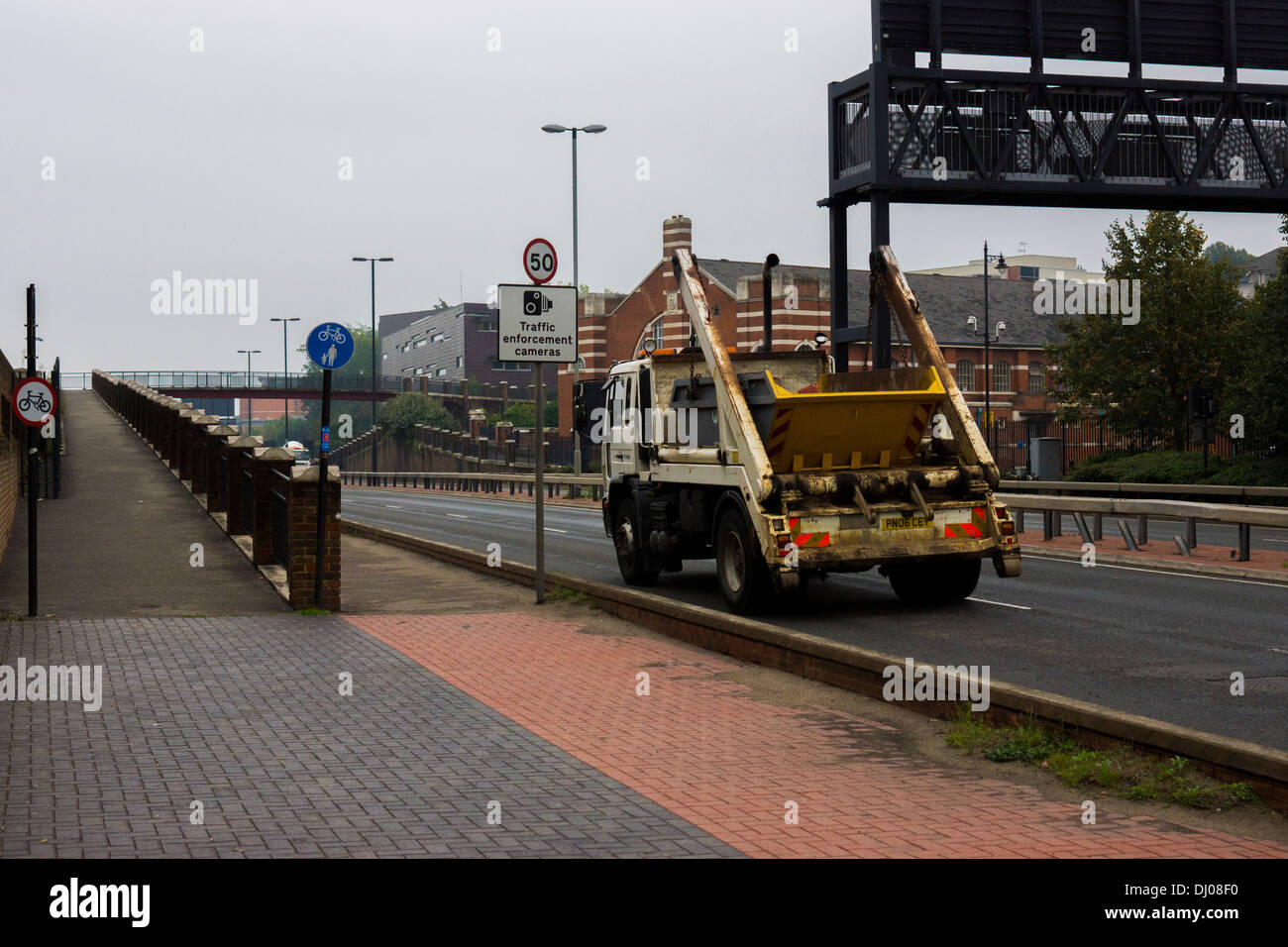 dump truck slowing down speed limit camera sign Stock Photo - Alamy
