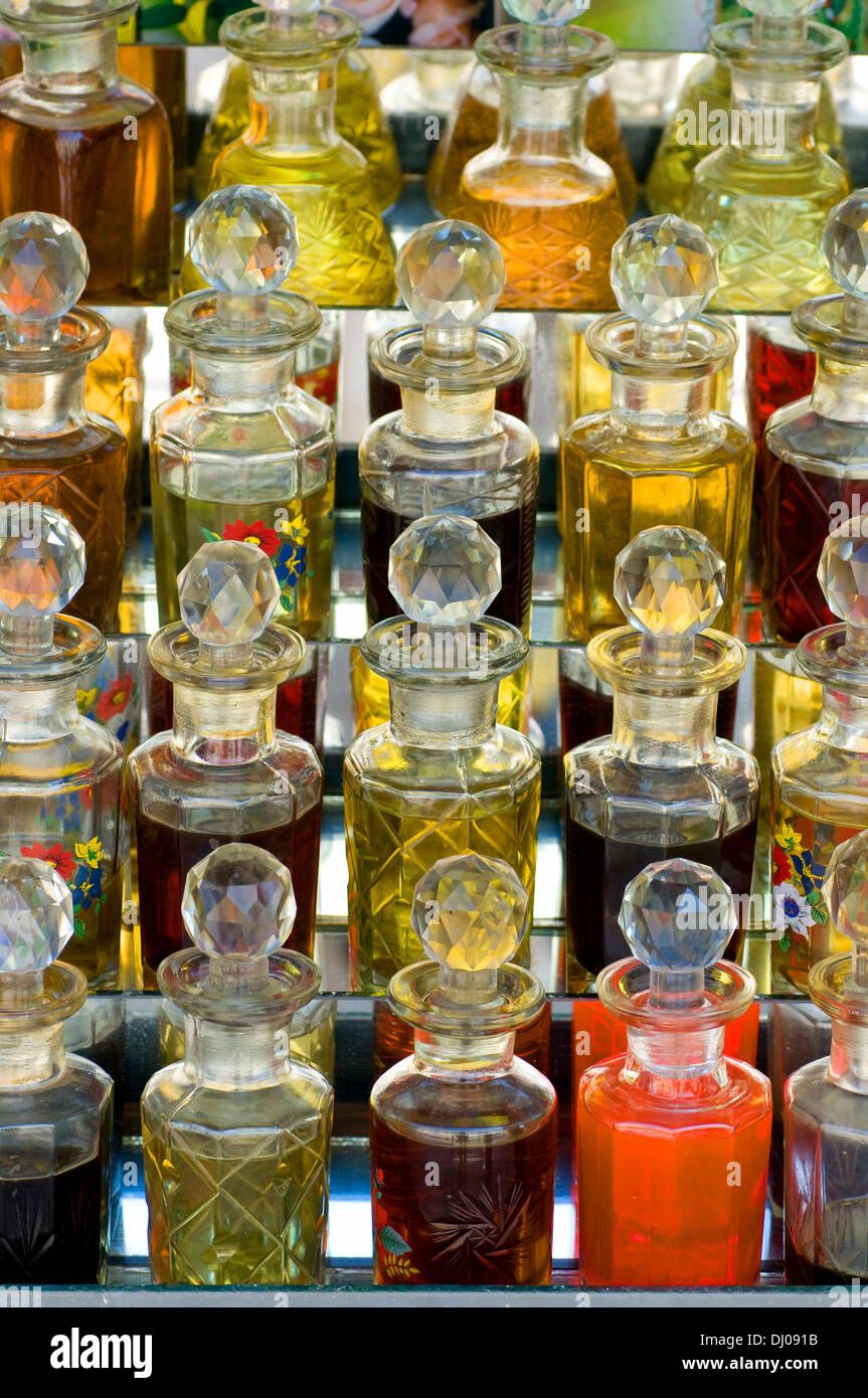Bottles of coloured scents on sale in South Indian village Stock Photo ...