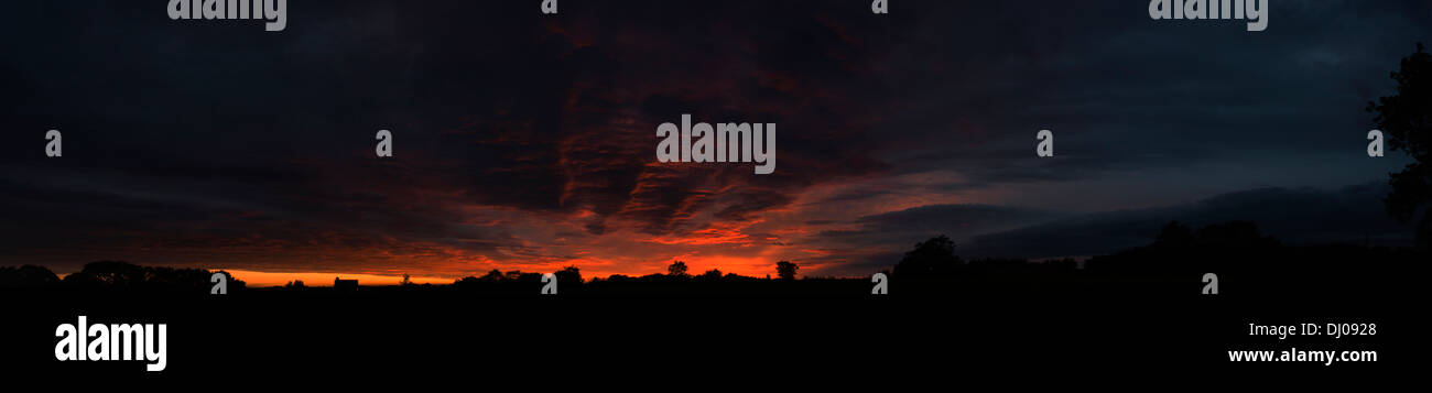 jet stream sunset amber storm clouds night dawn Stock Photo - Alamy