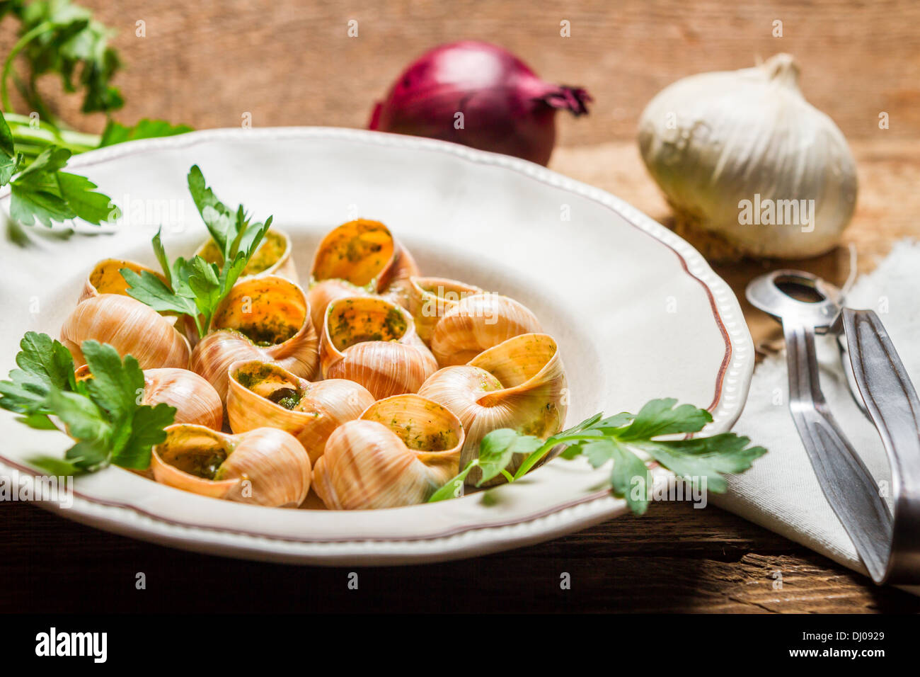 Homemade baked snails with garlic butter and fresh herbs Stock Photo ...