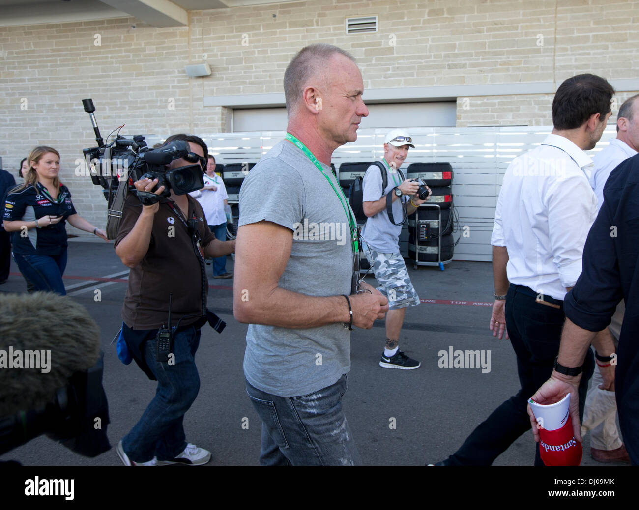 British musician Sting walks through the paddock area during the ...