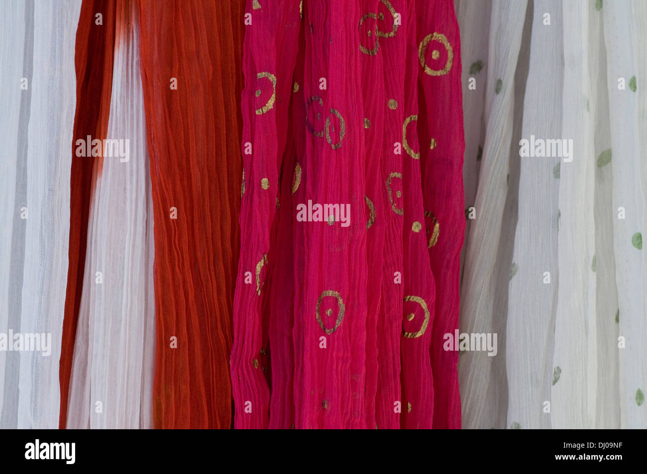 Coloured cloth hanging on sale in South India Stock Photo - Alamy