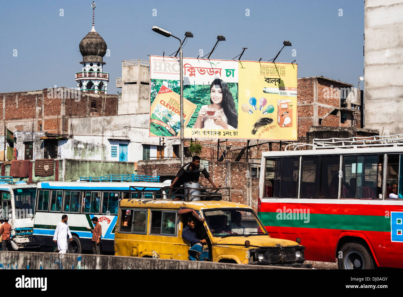 Heavy traffic, minaret and huge tea billboard on central Dhaka ...